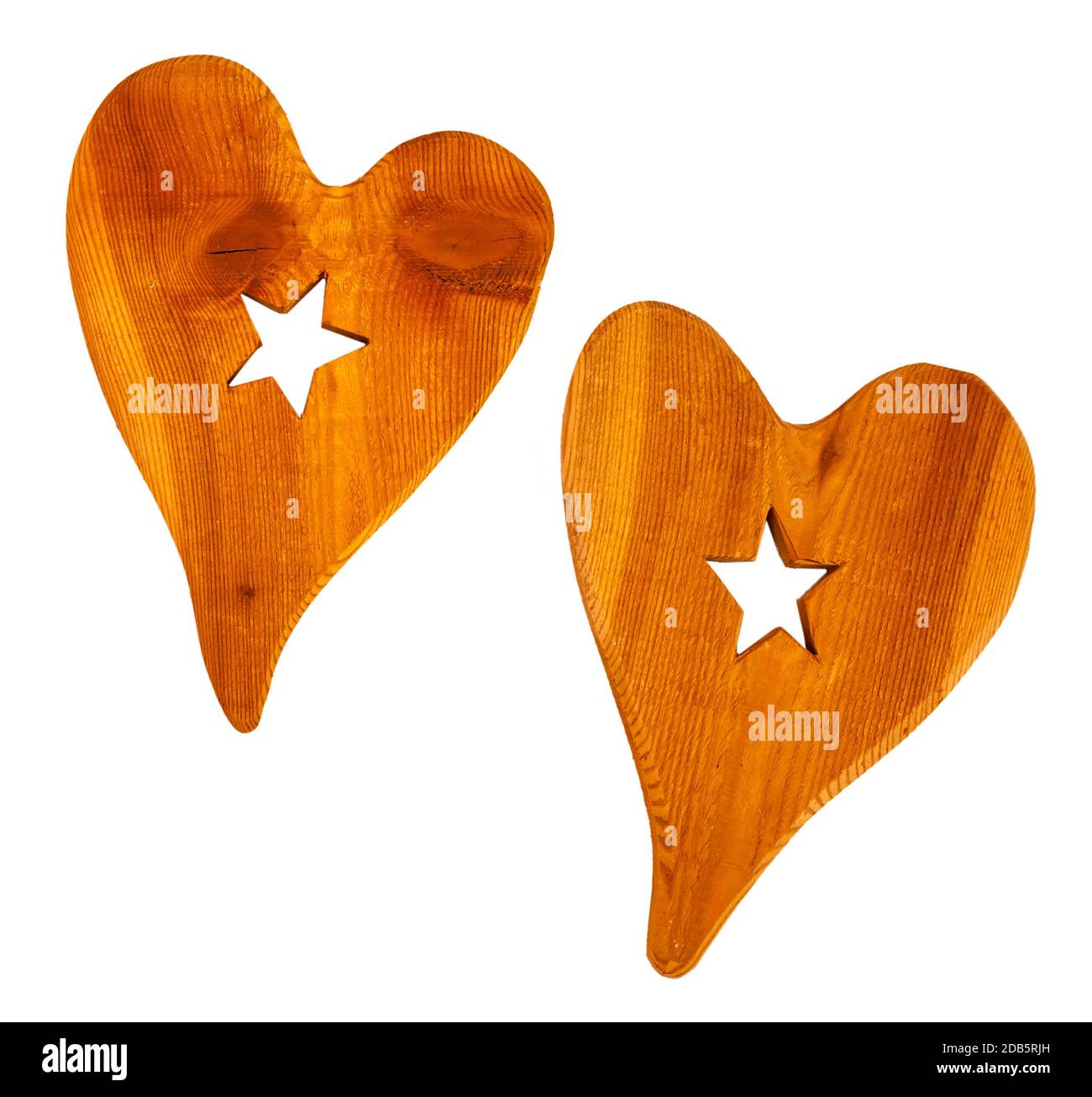 Two big wooden hearts sawn with stars in the middle Stock Photo - Alamy