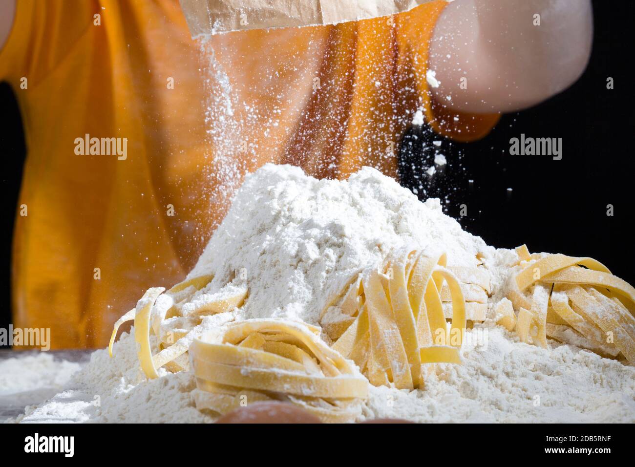 ready pasta with wheat flour while cooking, on the kitchen table in the ...