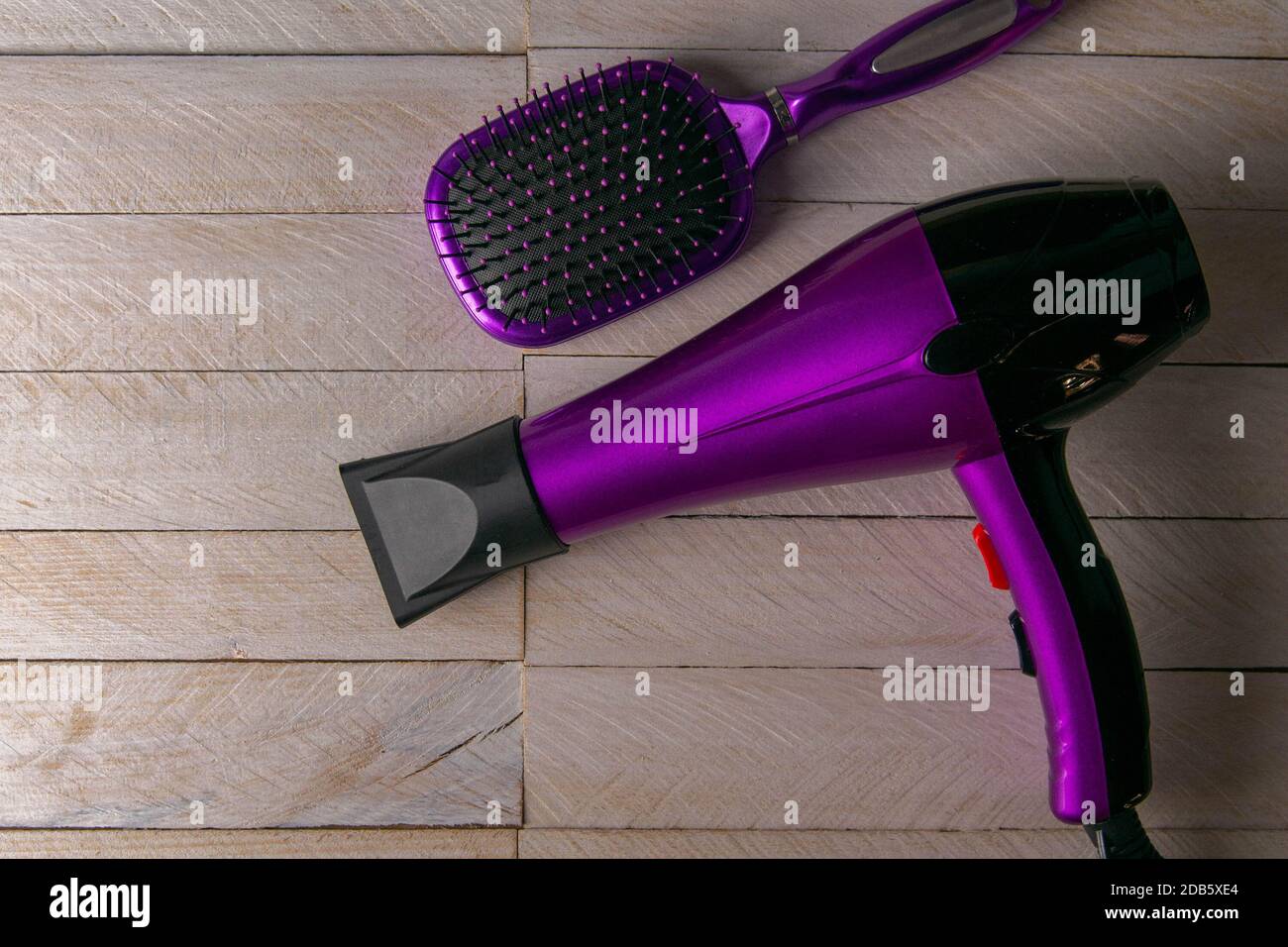 Professional hairdresser's set on white woodeb table, top view ...