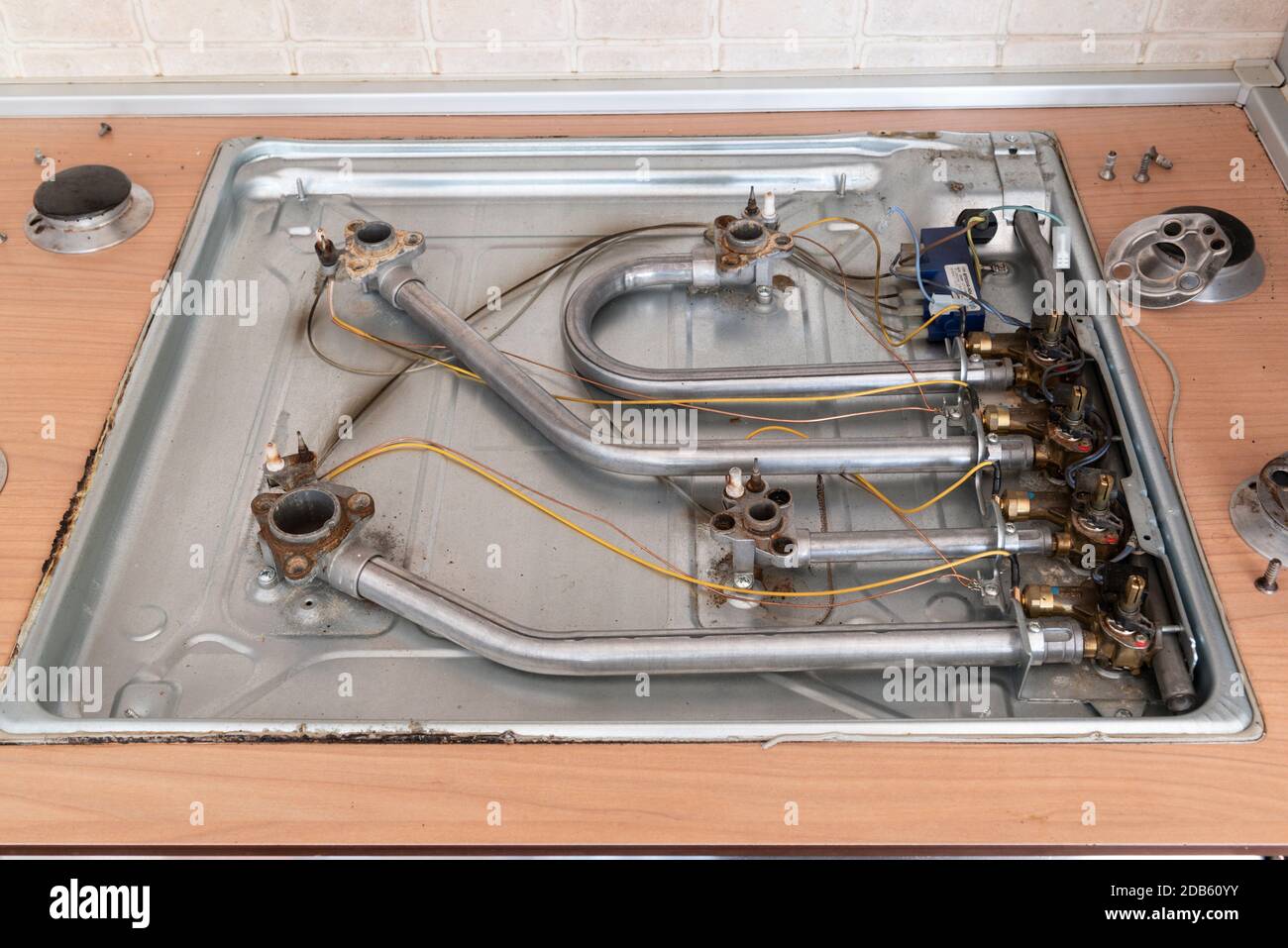 stove maintenance, under the forniture Stock Photo - Alamy