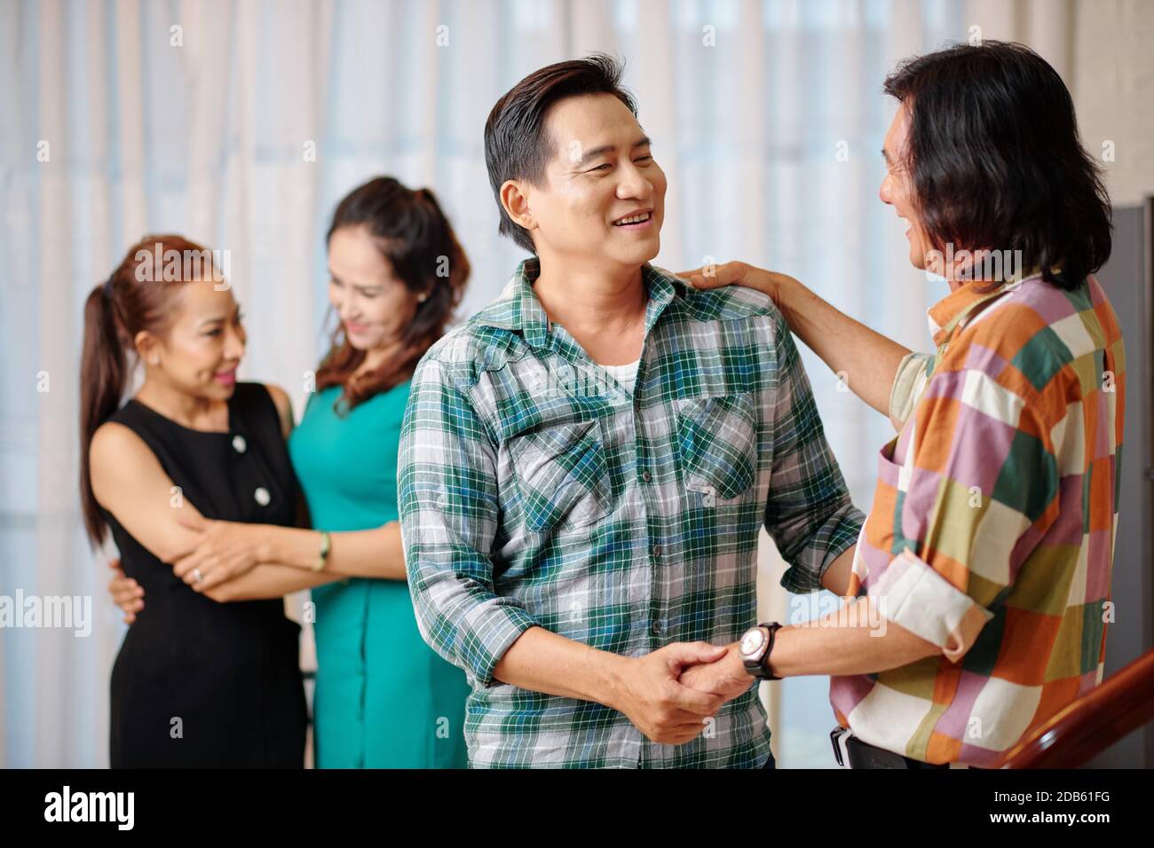 Friends happy to see each other Stock Photo - Alamy