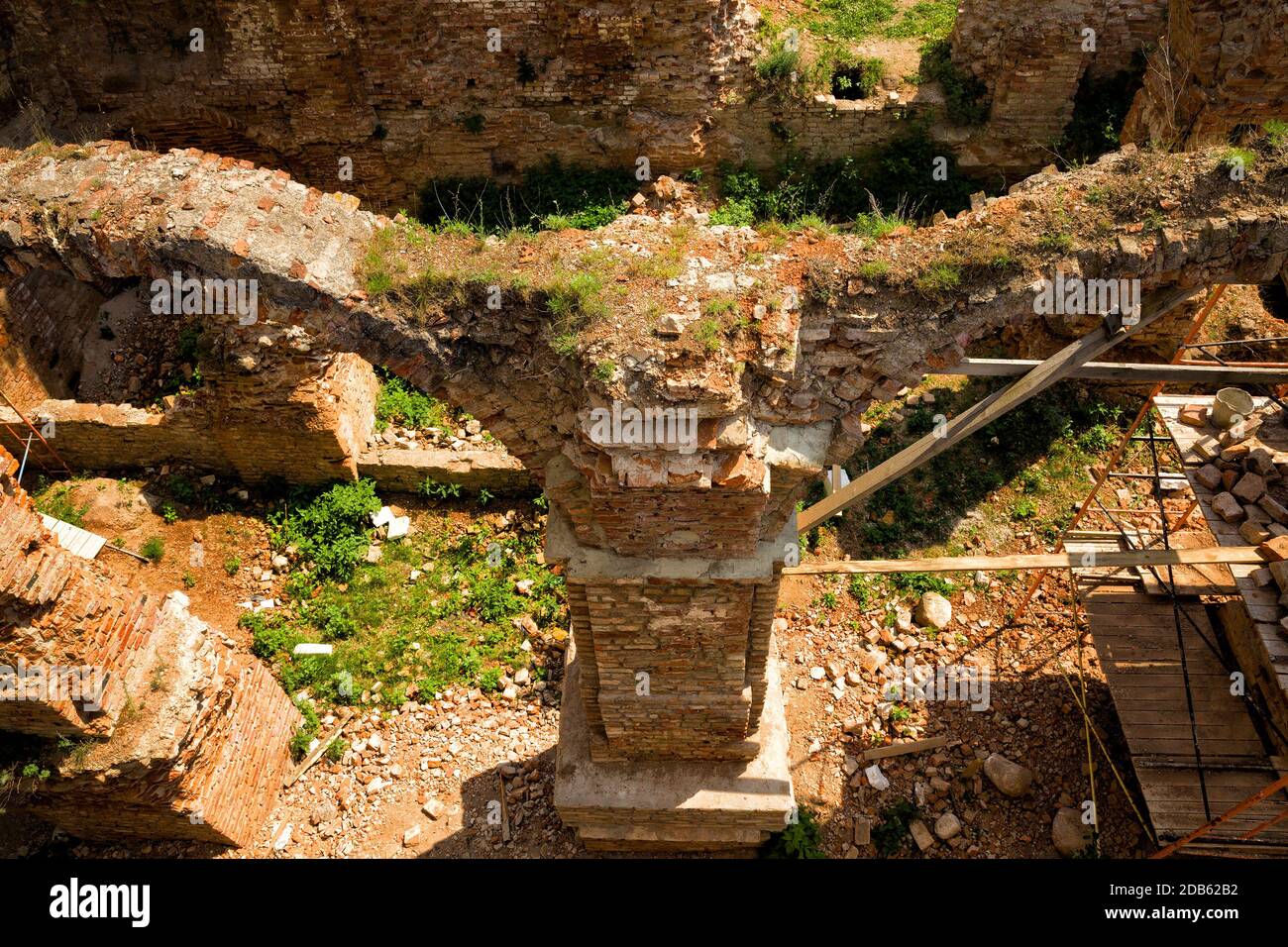 crumbling old brick tower and fortress walls, brick old arches made of ...