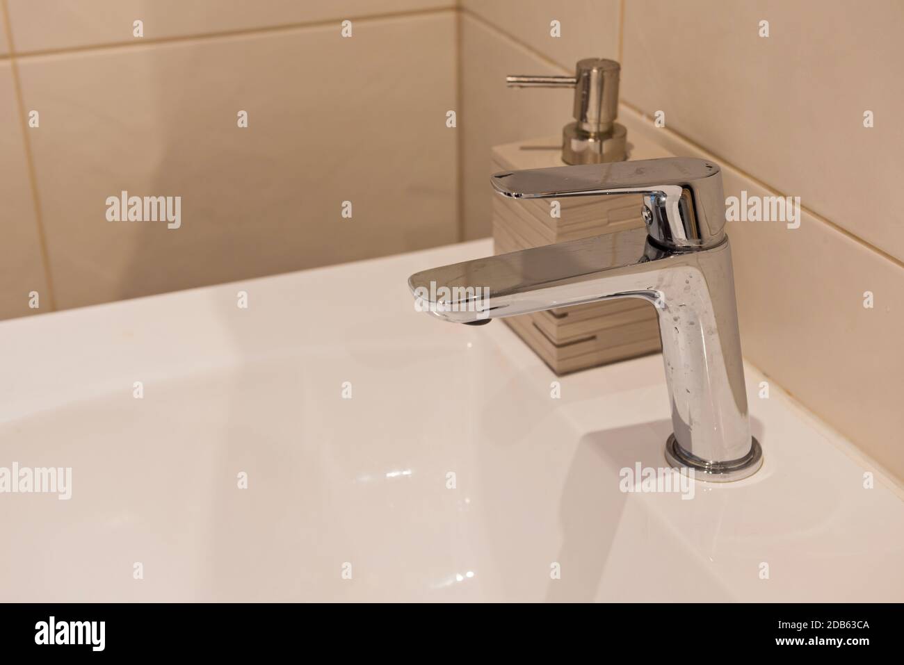 Bathroom interior with sink and faucet in apartment Stock Photo - Alamy