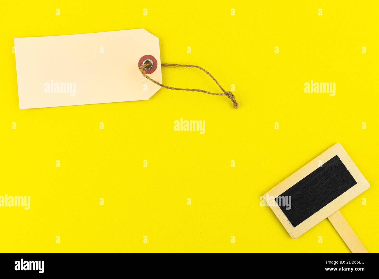 One blank brown gift tags with a string and a wooden tag on the right ...