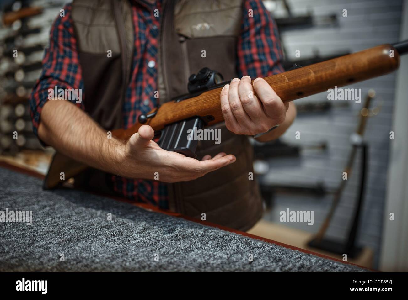 Man loads the gun hi-res stock photography and images - Alamy
