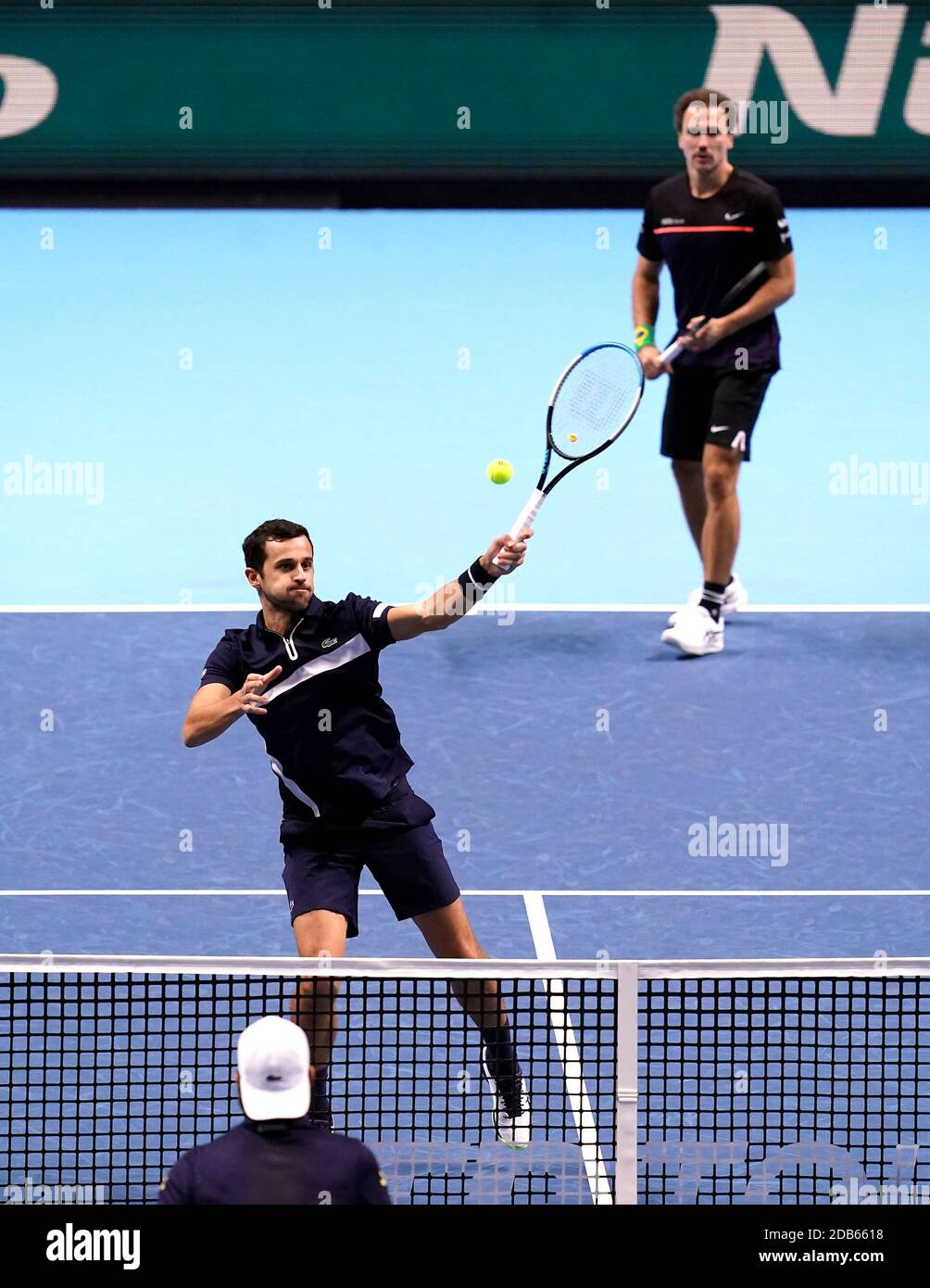 Mate Pavic and Bruno Soares (top) in action during their doubles match on day two of the Nitto ...