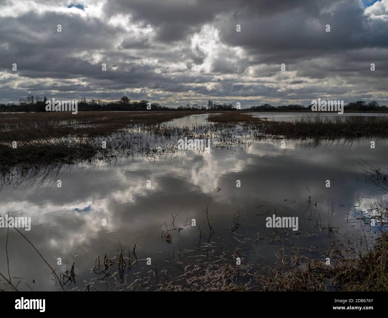 Dramatic cloudy sky over the flooded wetlands at Wheldrake Ings Nature ...
