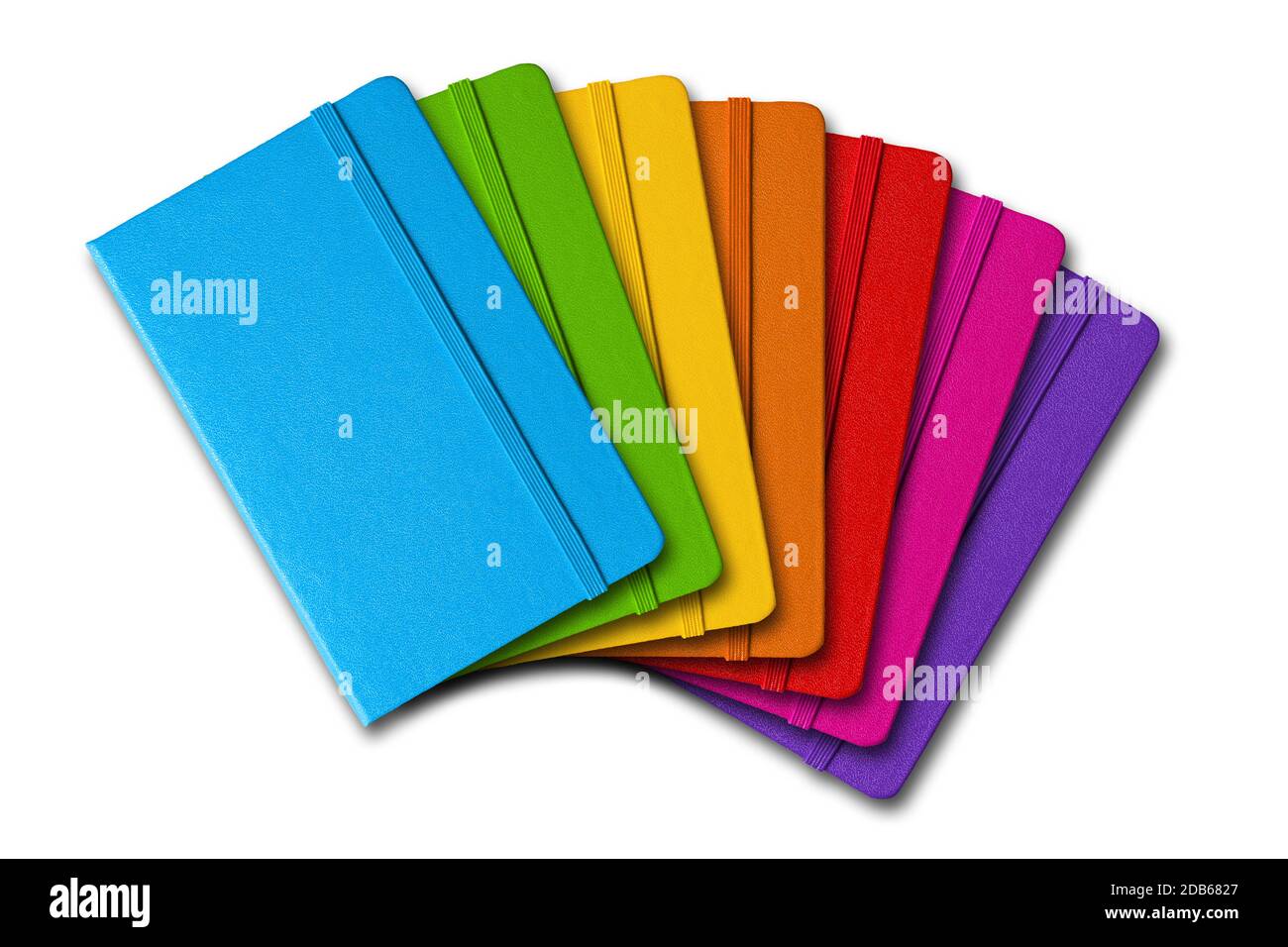 Multi color closed notebooks range isolated on white Stock Photo - Alamy
