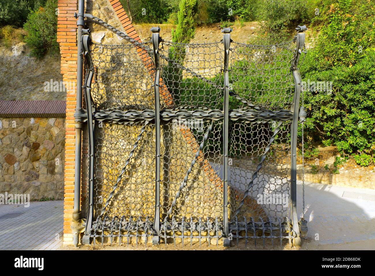 gates of a building designed by Gaudi in park Guel in Barcelona, Spain ...