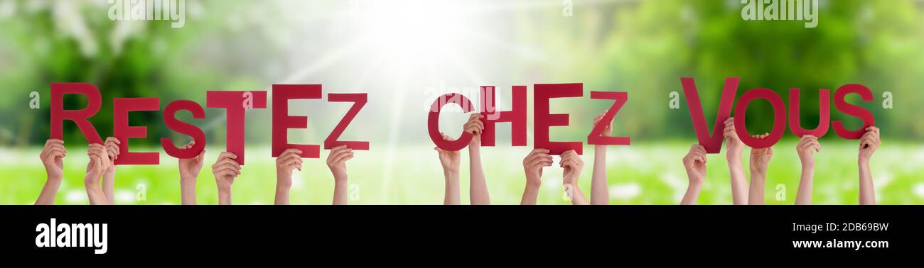 People Hands Holding Colorful French Word Restez Chez Vous Means Stay ...