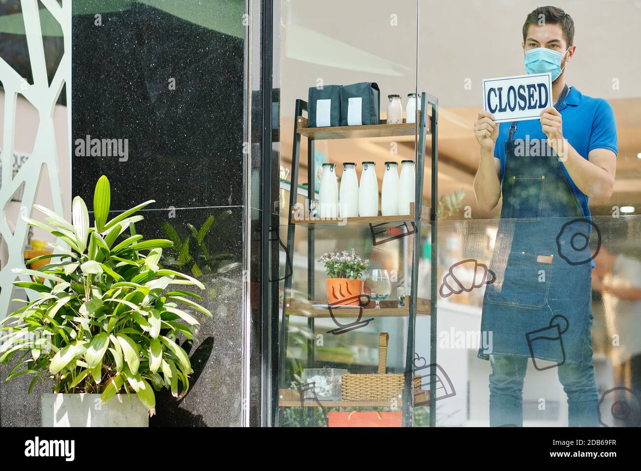 Sad owner closing cafe Stock Photo - Alamy