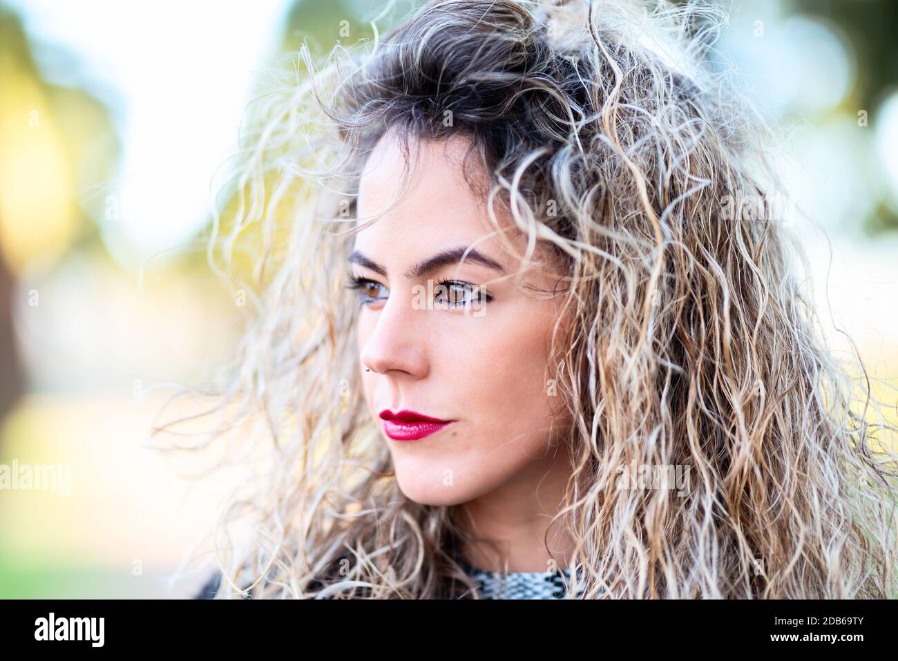 headshot of beautiful woman with curly hair Stock Photo - Alamy