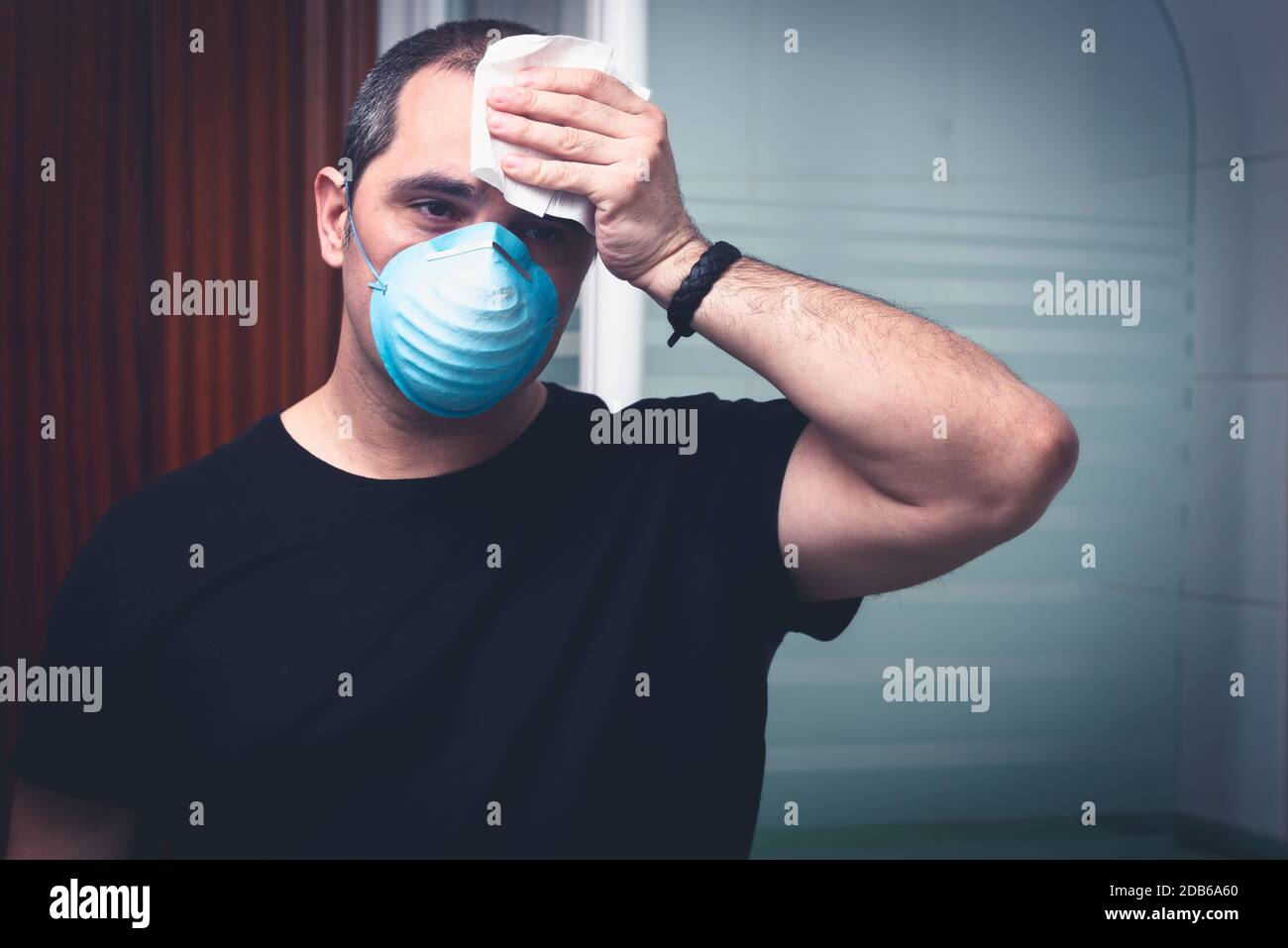 sick man wiping sweat with a handkerchief Stock Photo - Alamy