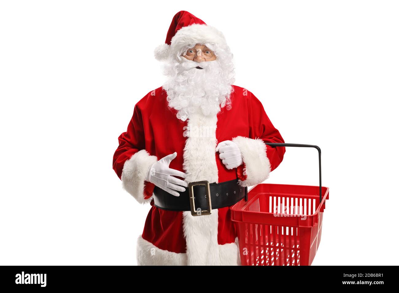 Santa claus holding an empty shopping basket isolated on white ...