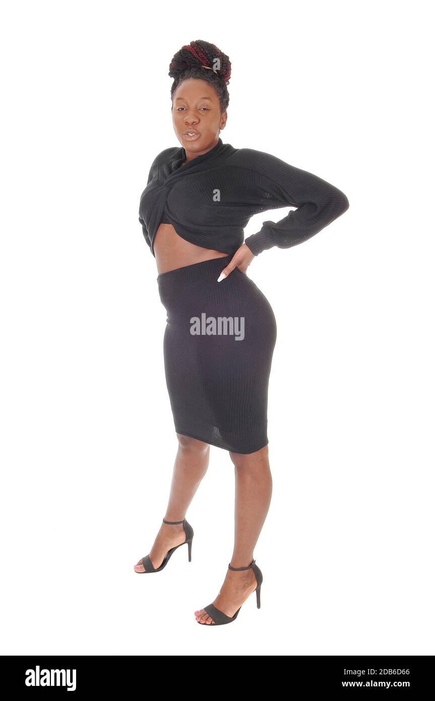 A beautiful young tall African American female standing in a tight gray ...