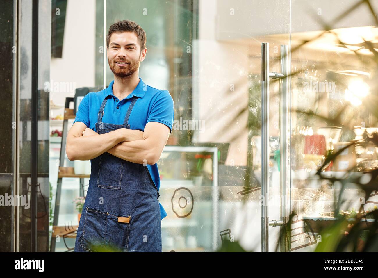 Confident cafe waiter Stock Photo - Alamy