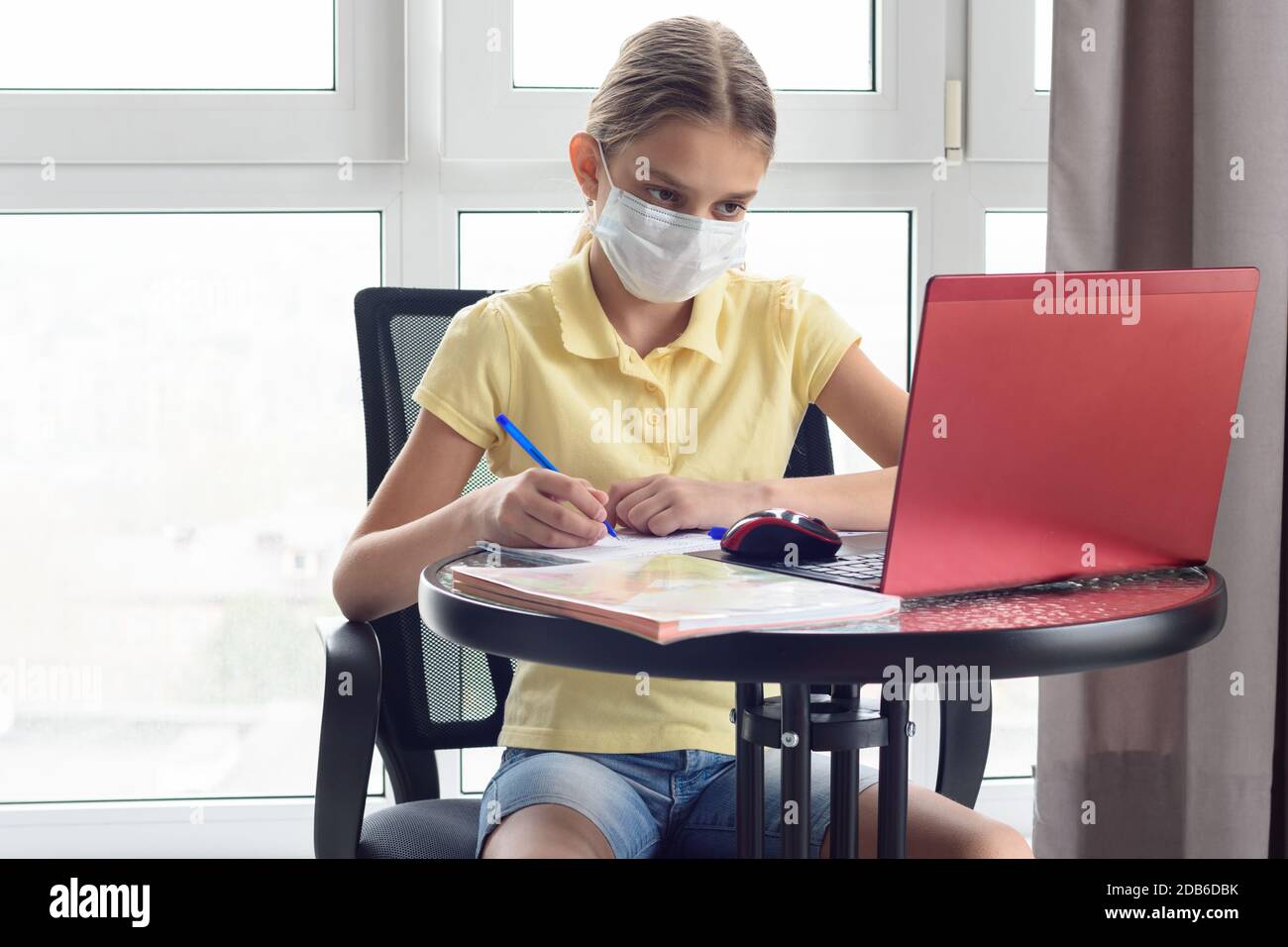 Self-isolation girl remotely educates online Stock Photo - Alamy