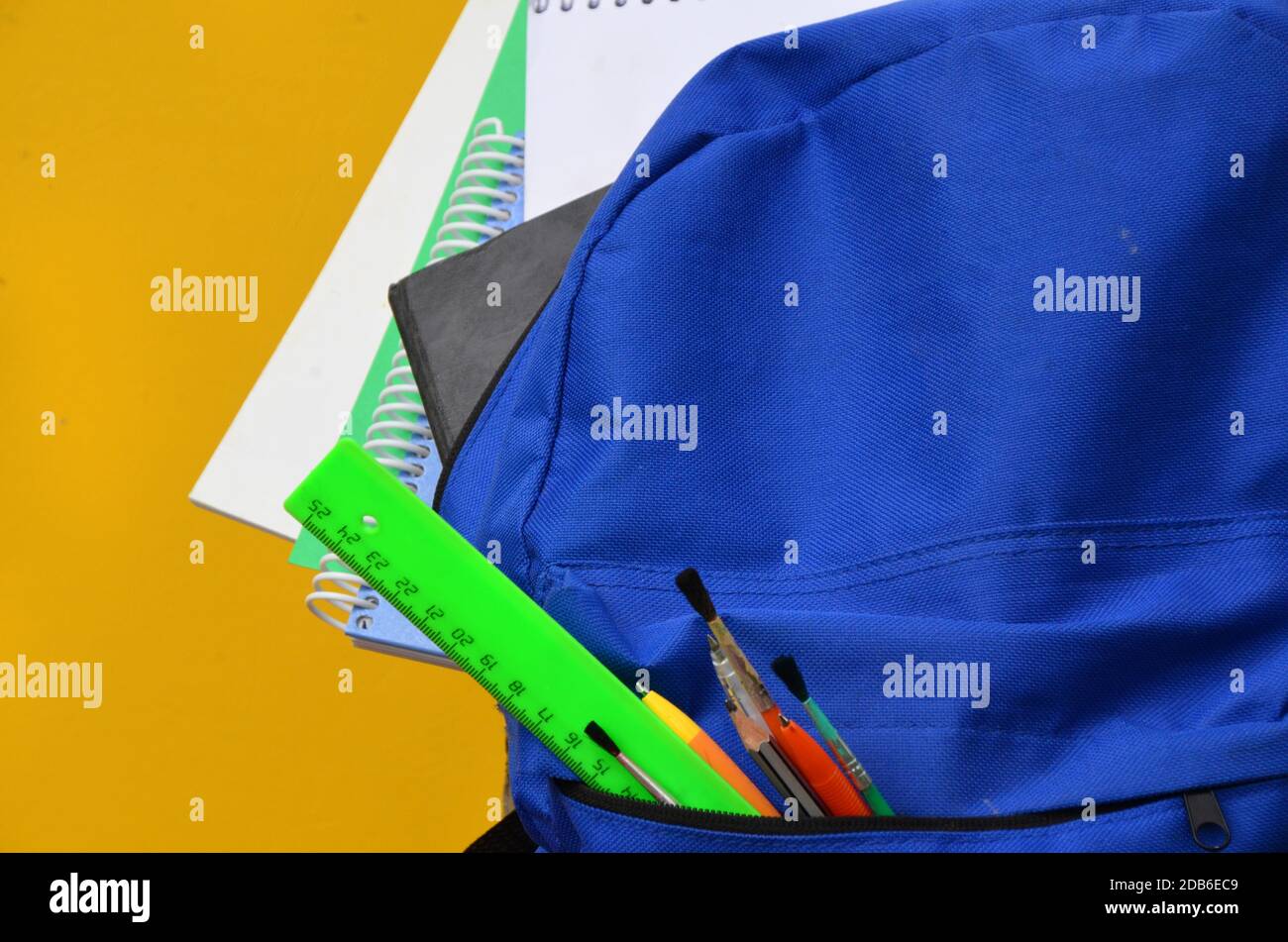 Full School backpack on wooden and nature background school supplies ...