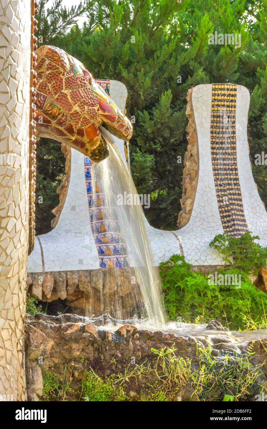 Mosaic snake fountain at the Parc Guell designed by Antoni Gaudi ...