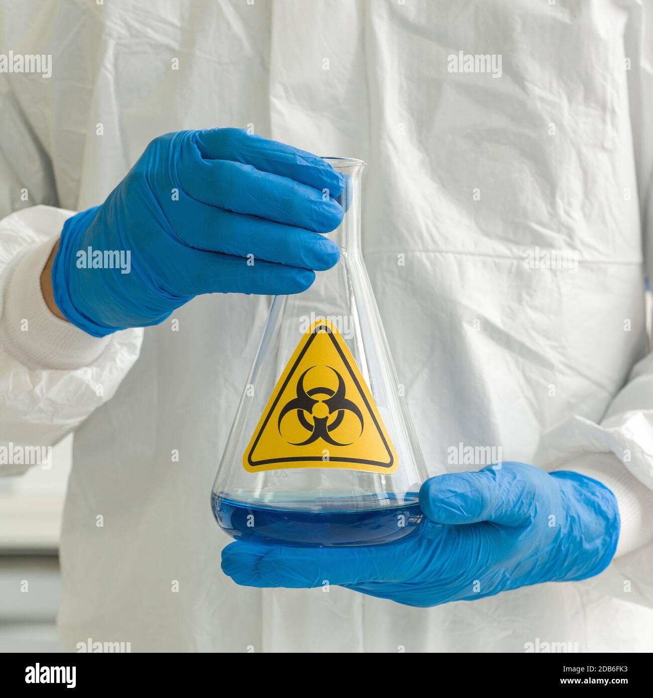 Erlenmeyer Flask contains blue liquid chemicals in experts hands Stock ...