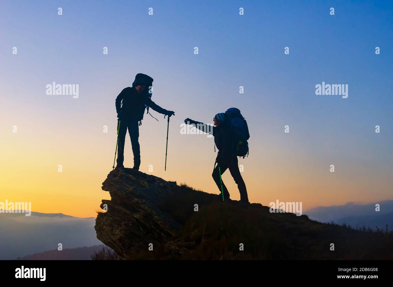 Teamwork couple hiking help other hi-res stock photography and images ...