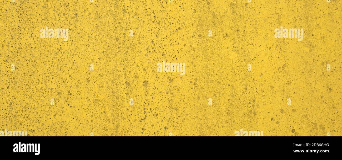 wide yellow concrete texture useful as a background Stock Photo - Alamy