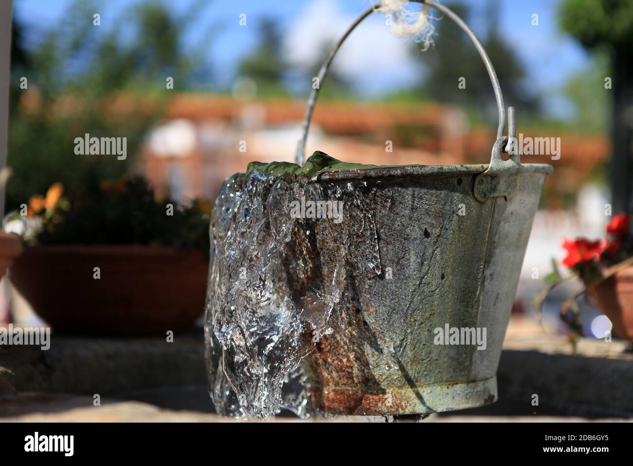 Lessons from the well bucket of refreshing water Stock Photo - Alamy