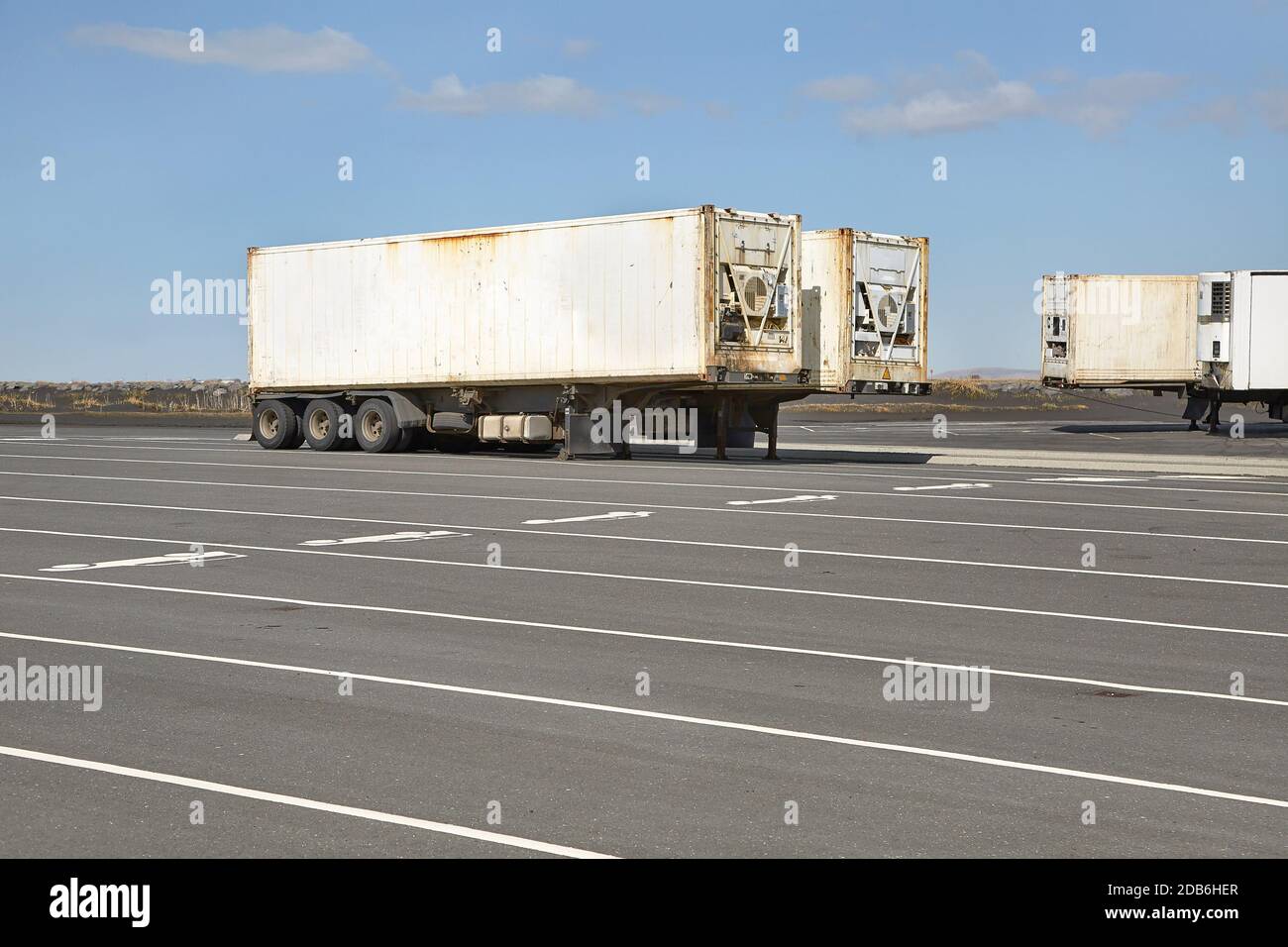 Cargo containers in truck trailers in a parking lot in Iceland Stock ...