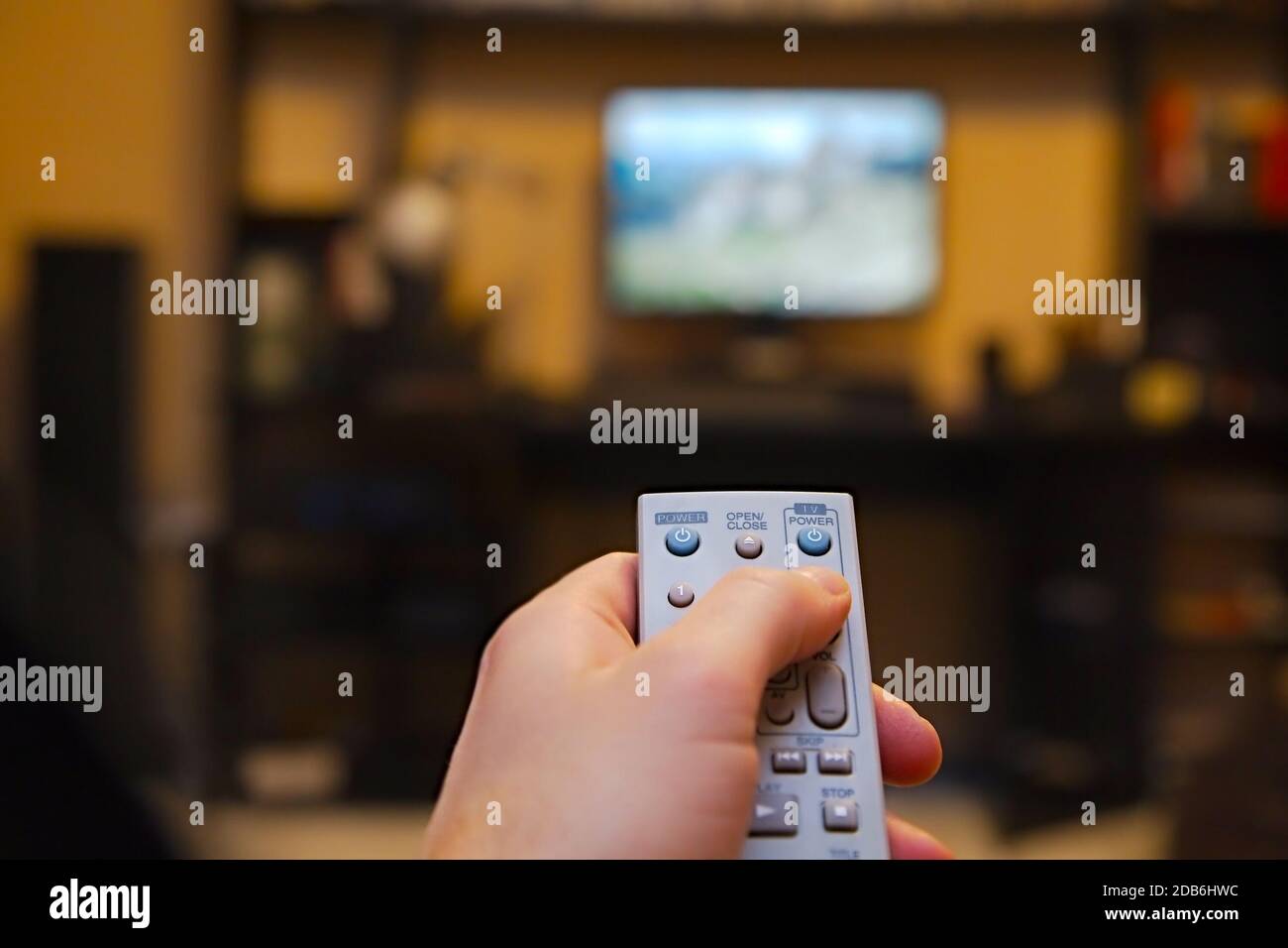 Using remote control for switching programs Stock Photo - Alamy