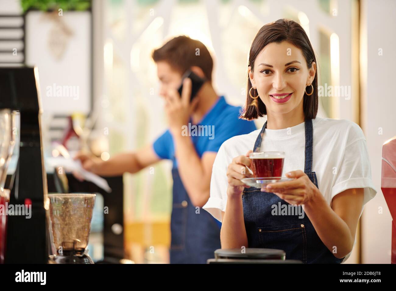 Beautiful young female barista hi-res stock photography and images - Alamy