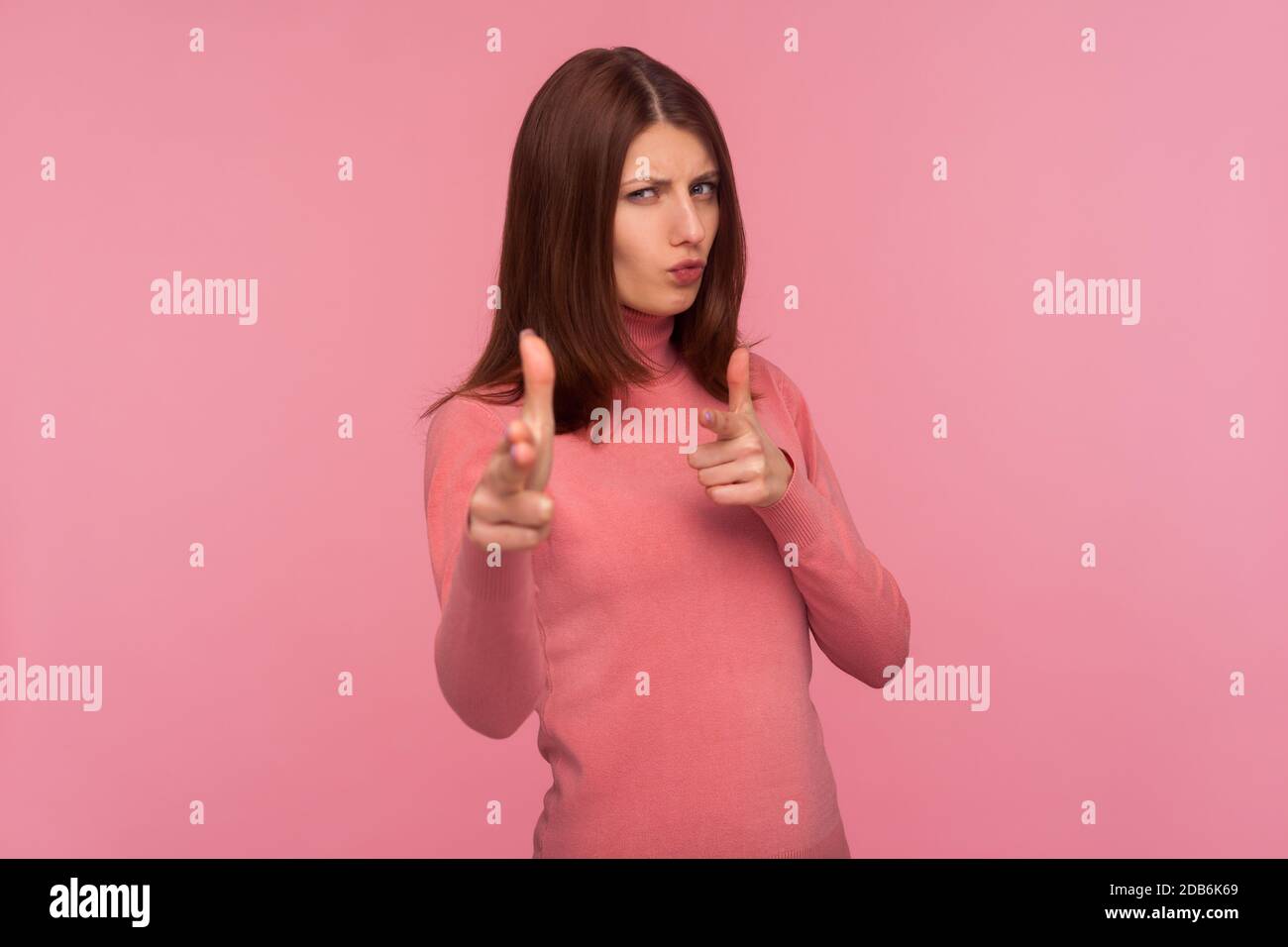 Assertive self confident woman with brown hair in pink sweater showing ...