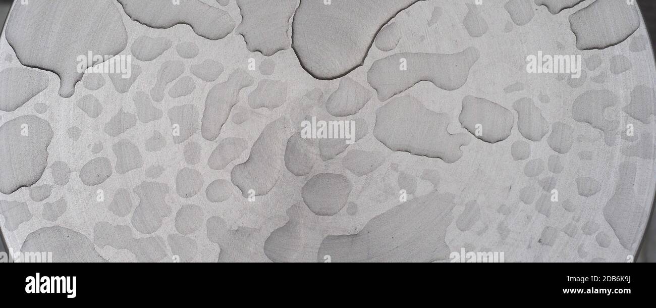 wide wet grey steel texture with droplets of water useful as a ...