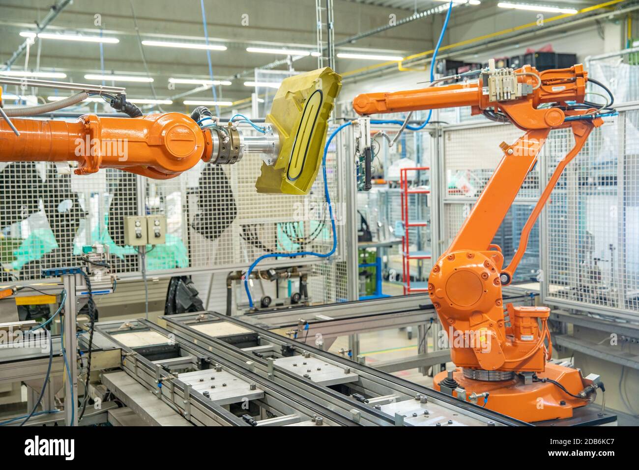 dismantling the robotic arms in the factory when relocating production ...