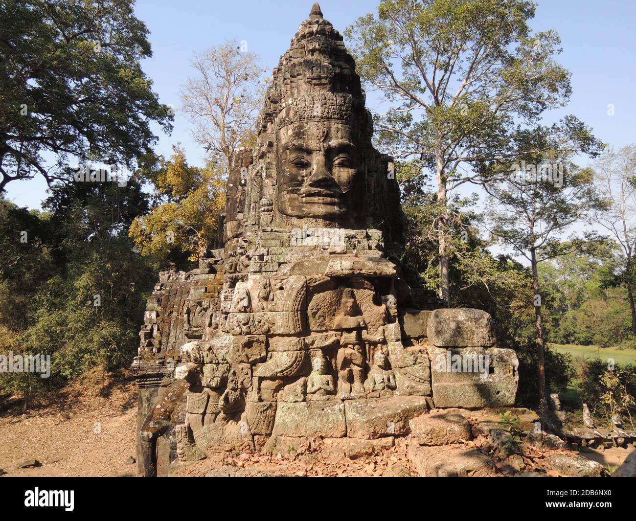 Faces masoned in Stone in Cambodia Angkor smiling ancient culture Stock ...