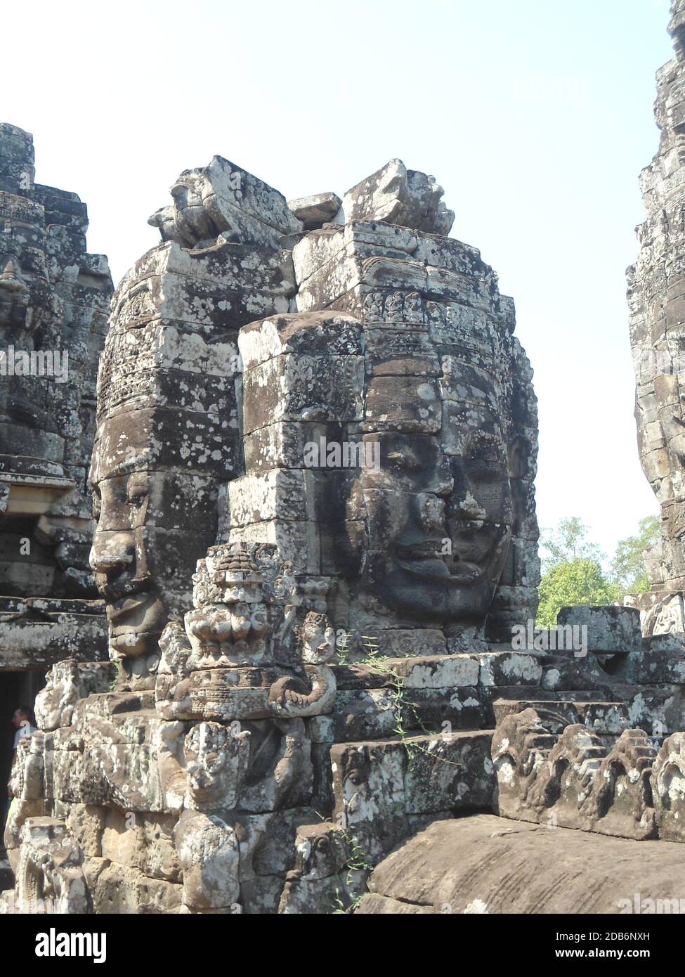 Faces masoned in Stone in Cambodia Angkor smiling ancient culture Stock ...
