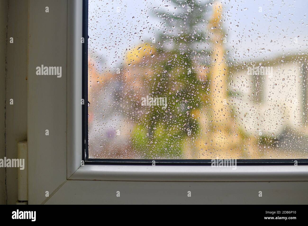 Water stains on the glass behind the rain. Wet home window with ...