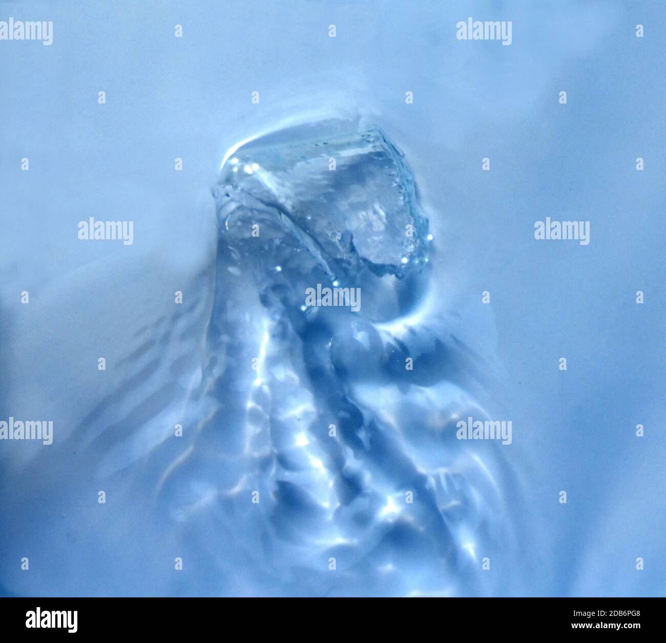 A small blue water droplet with sunlight Stock Photo - Alamy