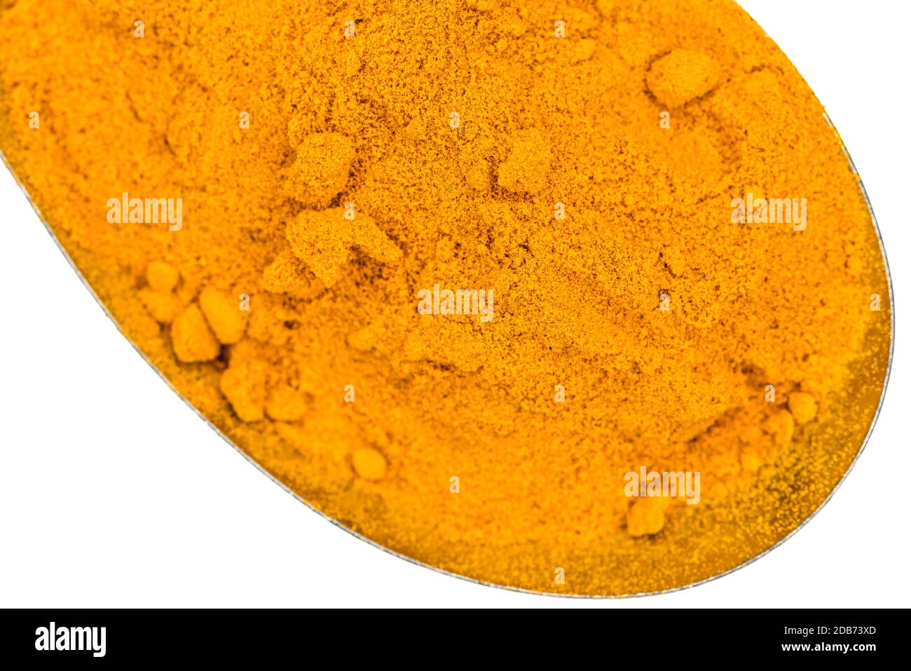 turmeric powder on a spoon Stock Photo - Alamy