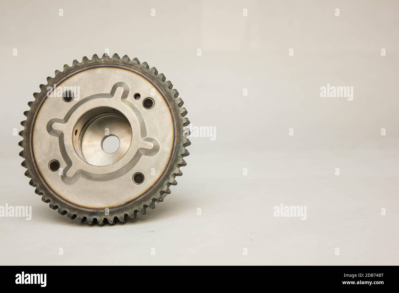 New details on a gray background. The camshaft gears Stock Photo - Alamy