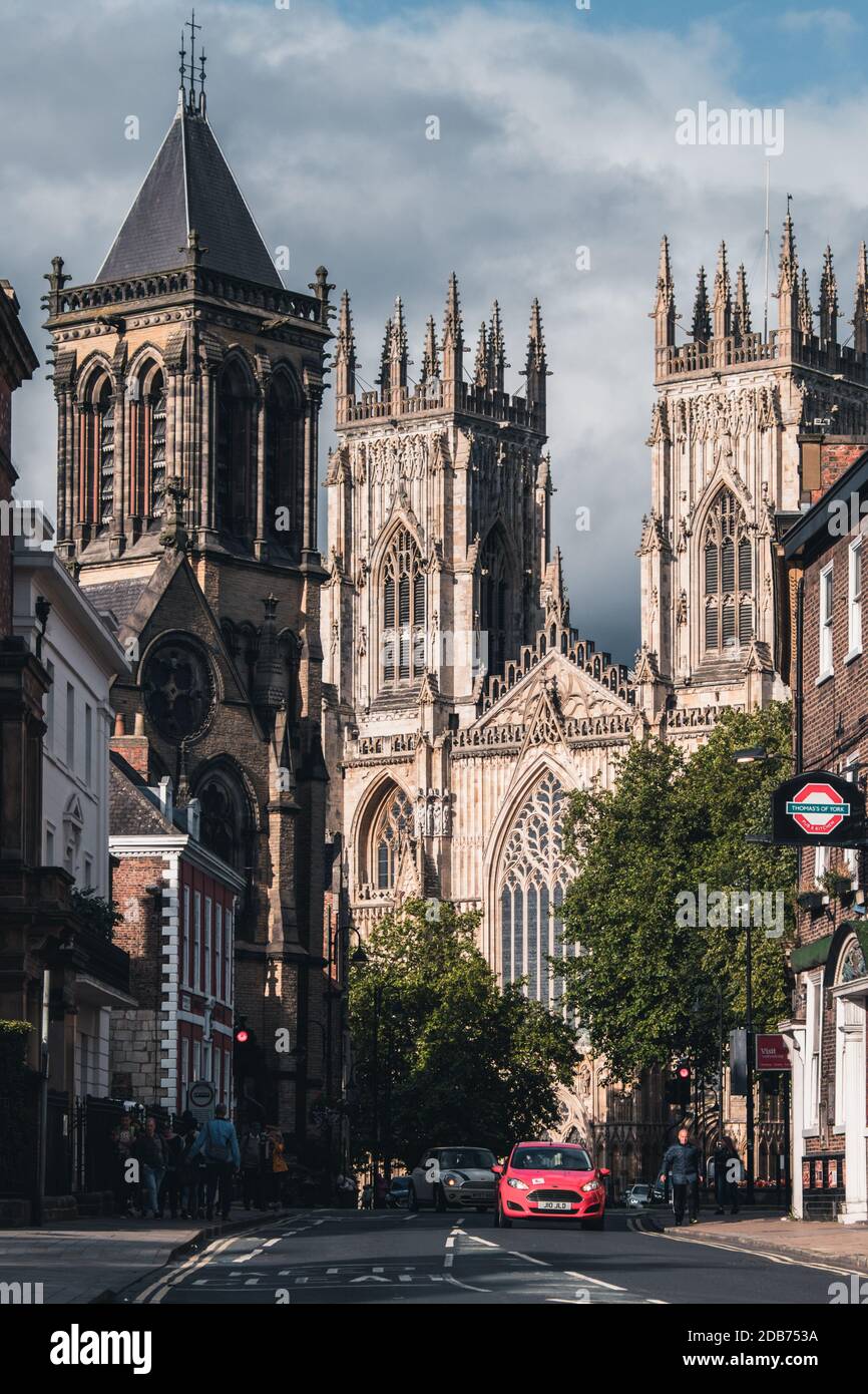 Street scene in York with a view of the York Cathedral and several ...