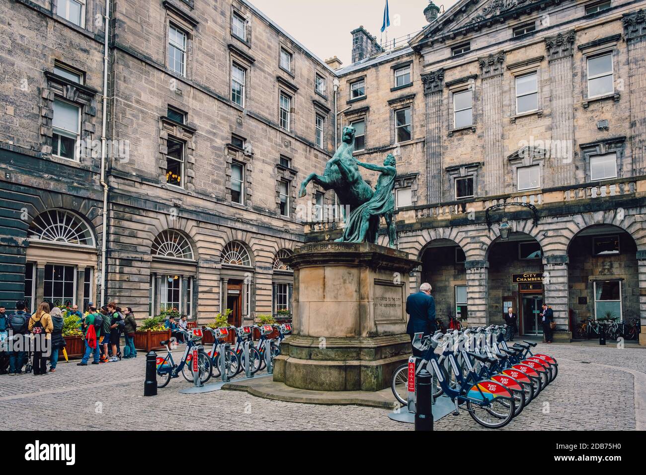 The historic Edinburgh City Chambers with the famous statue of ...