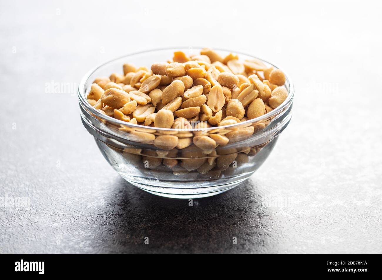 Roasted salted peanuts. Crispy nuts in bowl Stock Photo - Alamy