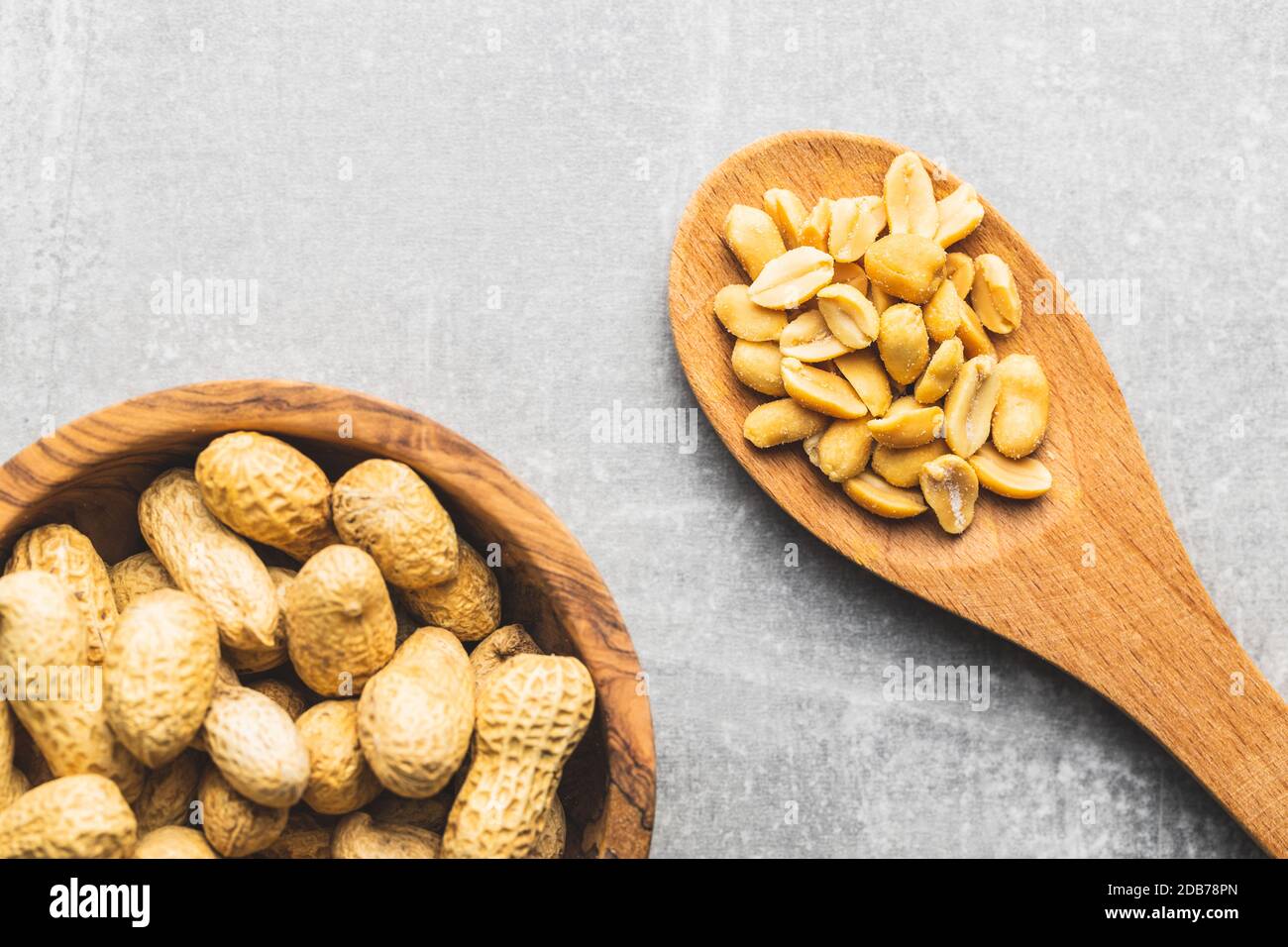 Roasted salted peanuts. Crispy nuts in wooden spoon. Top view Stock ...