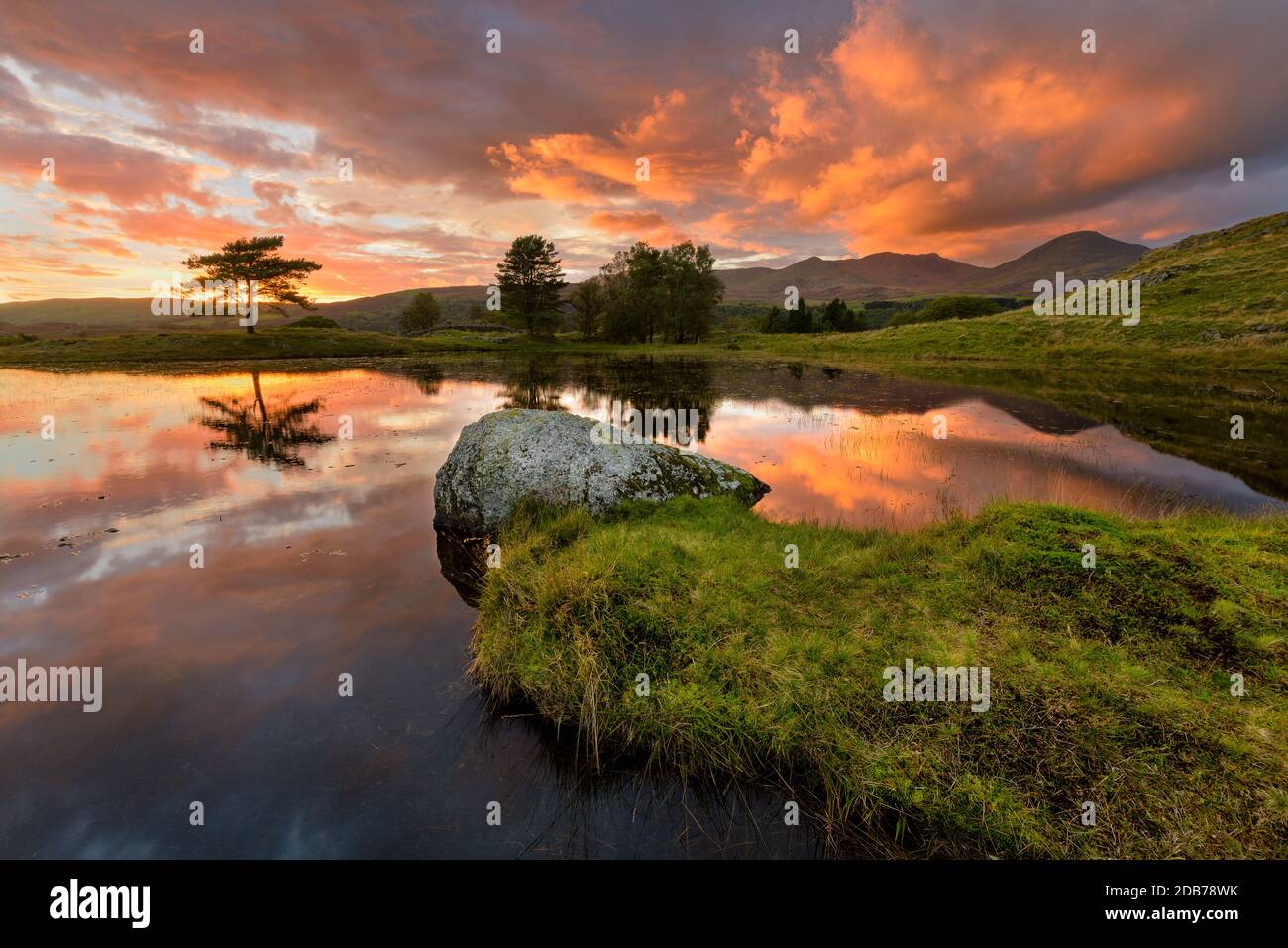Fiery Dramatic Sunset Over Kelly Hall Tarn In The English Lake District ...