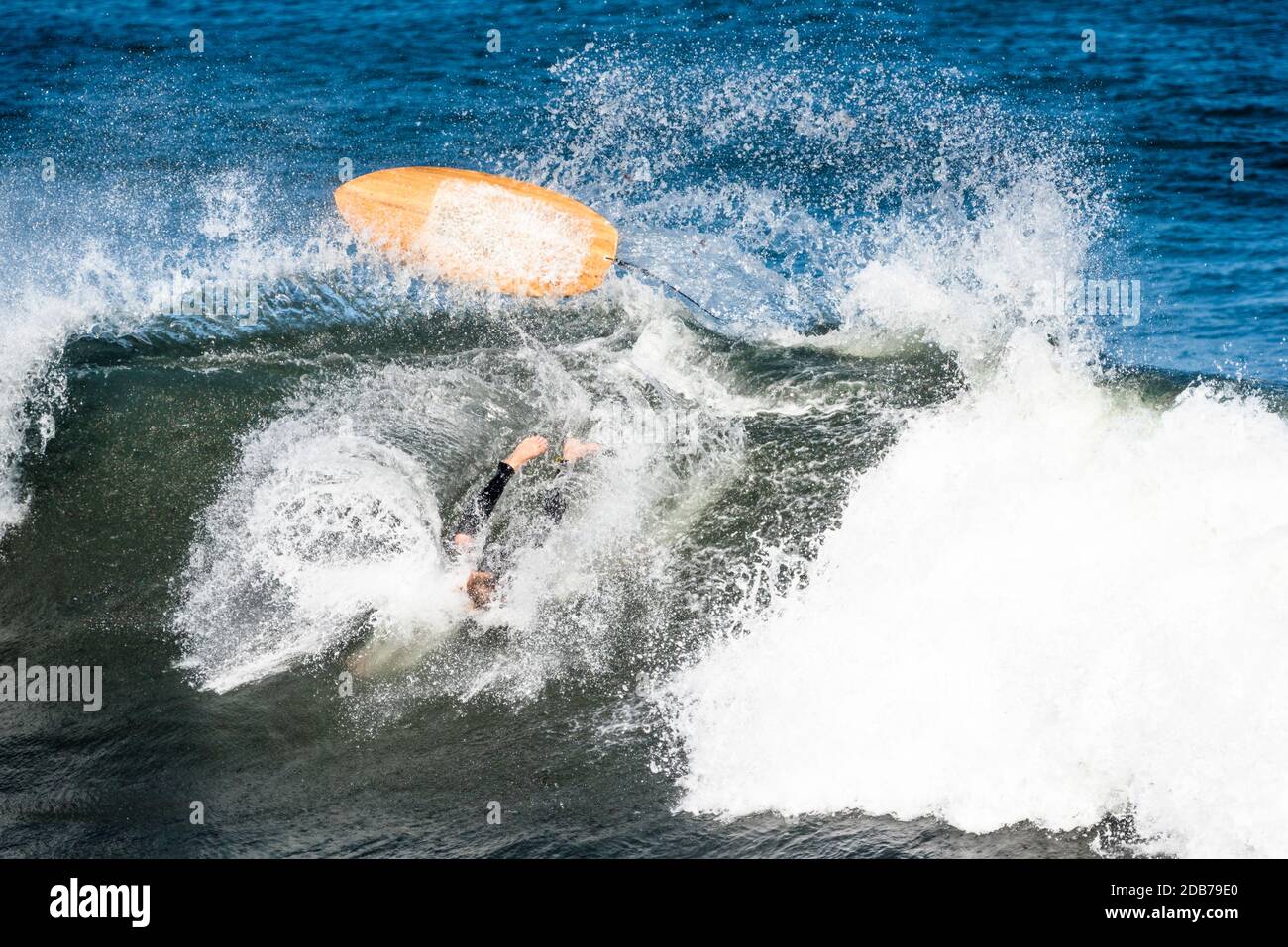 Young man falling on summer surf in Rhode Island Stock Photo - Alamy