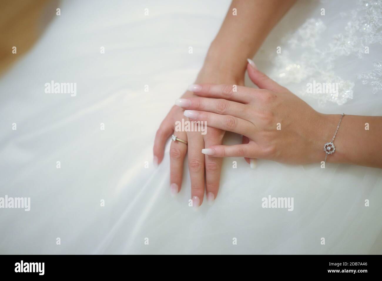 Brides hands on lap hi-res stock photography and images - Alamy