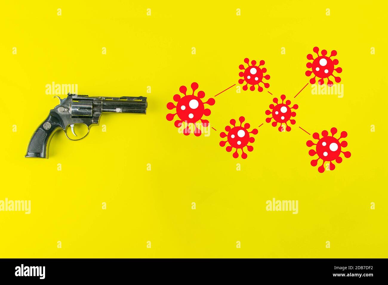 A black gun and a drawn COVID-19 virus. The coronavirus epidemic kills ...