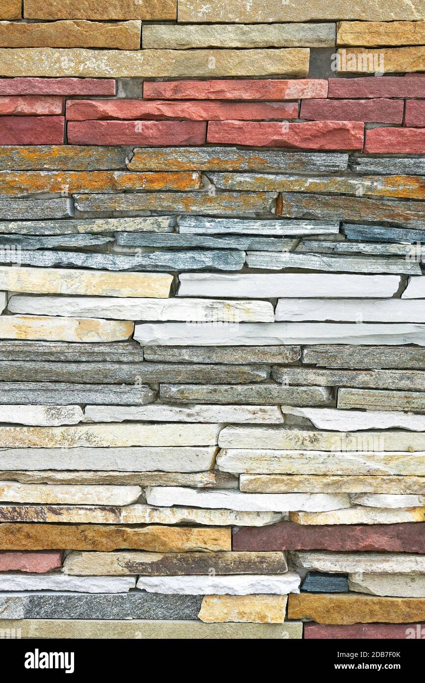 Wall made from natural stones in layers Stock Photo - Alamy