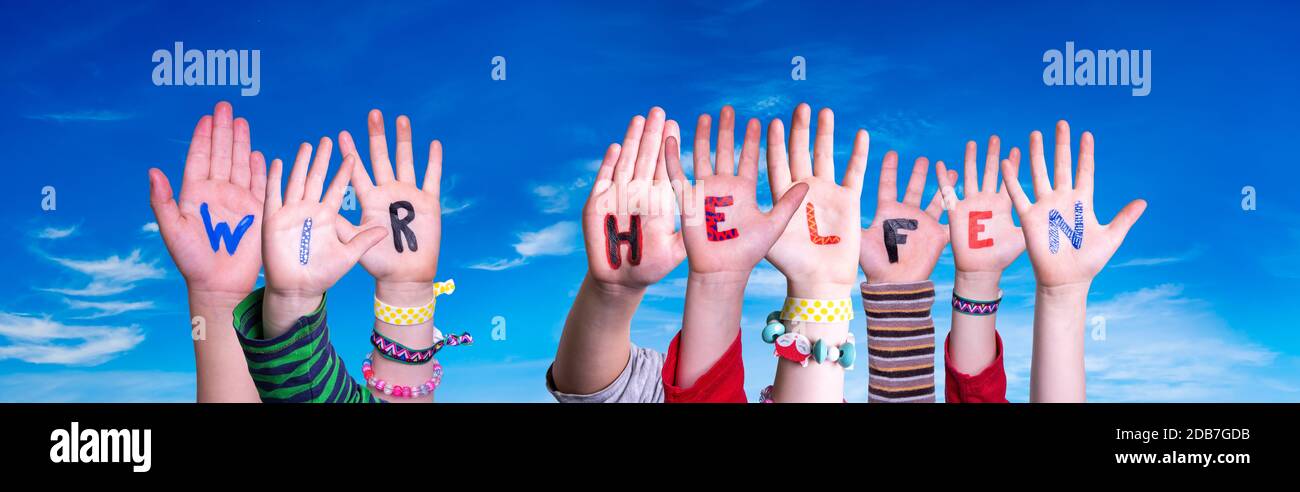 Kids Hands Holding Colorful German Word Wir Helfen Means We Help. Blue ...