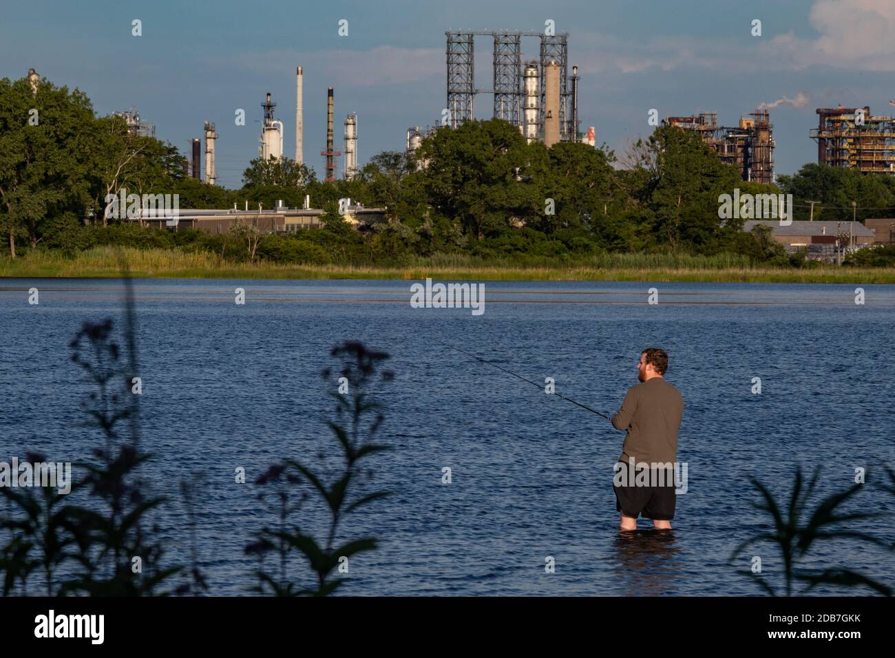 BP oil refinery in Whiting Indiana, with fisherman in nearby Lake ...